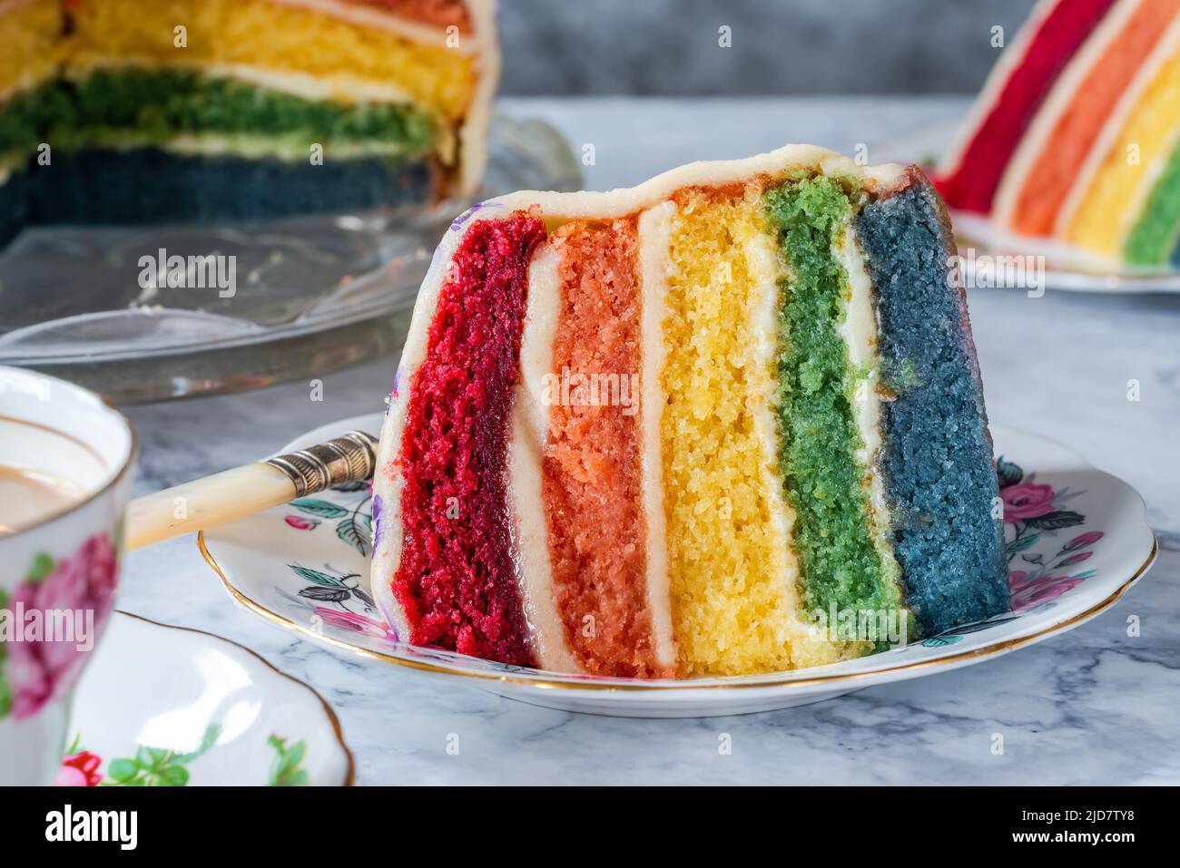 Multi layered rainbow cake - sweet afternoon dessert Stock Photo - Alamy