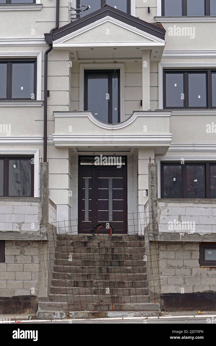 New white building house construction site front view Stock Photo - Alamy