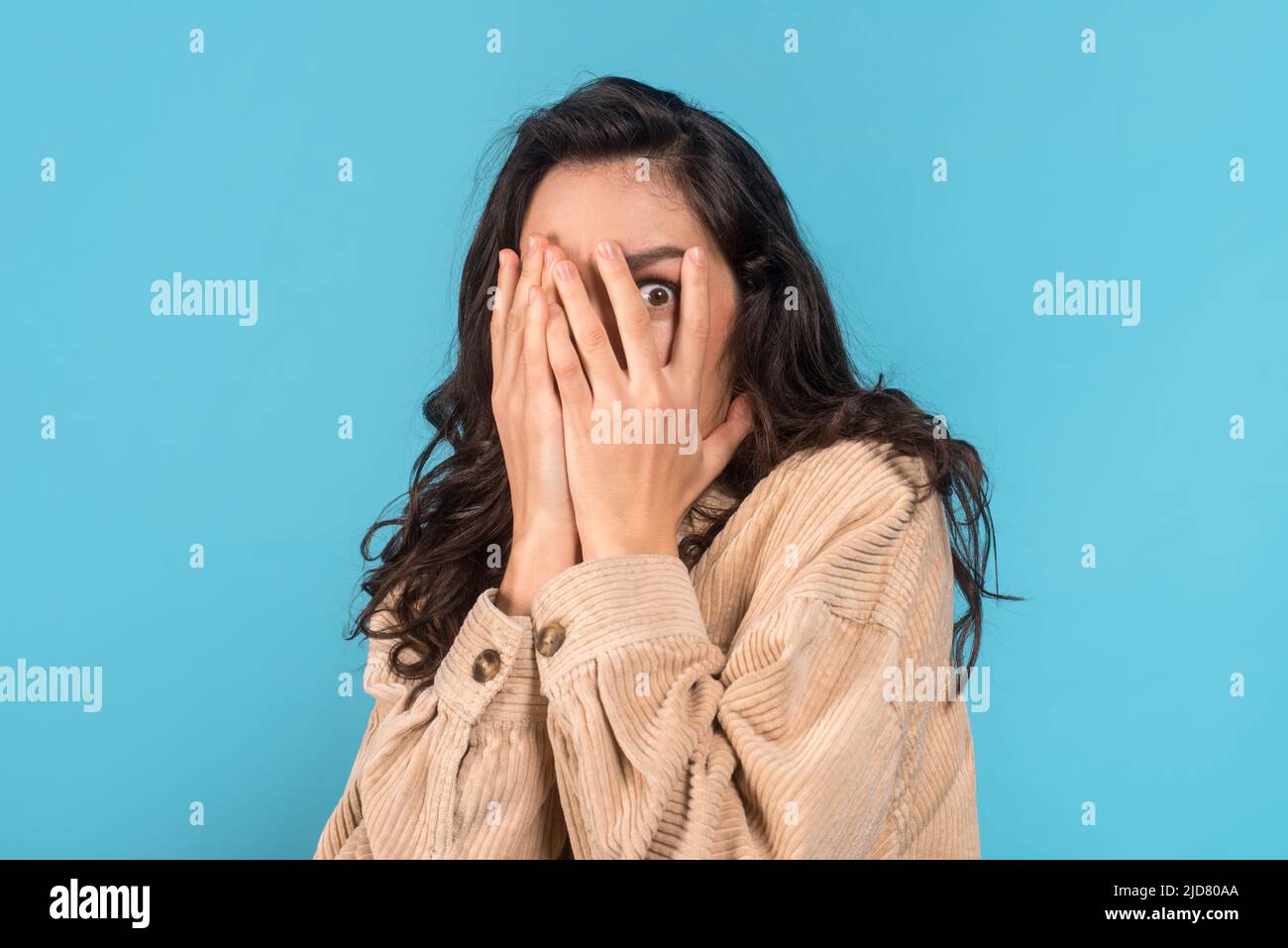 Scared young woman covers face hi-res stock photography and images - Alamy