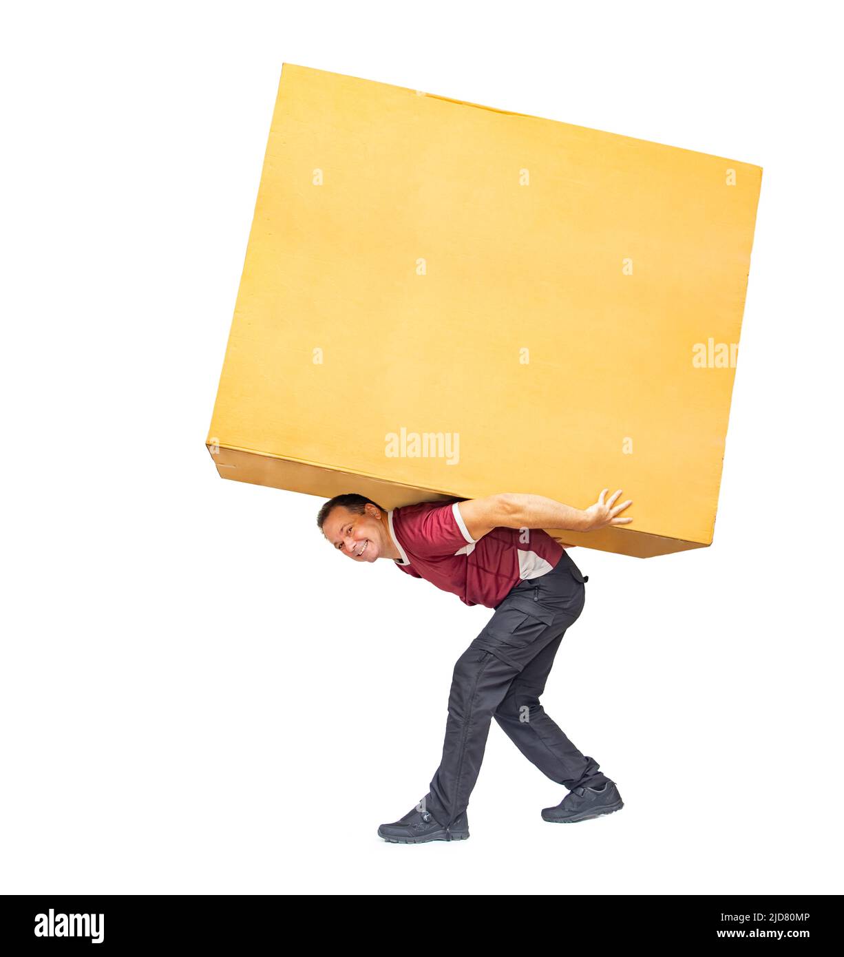 The smiling courier delivering an oversized package, isolated on a ...