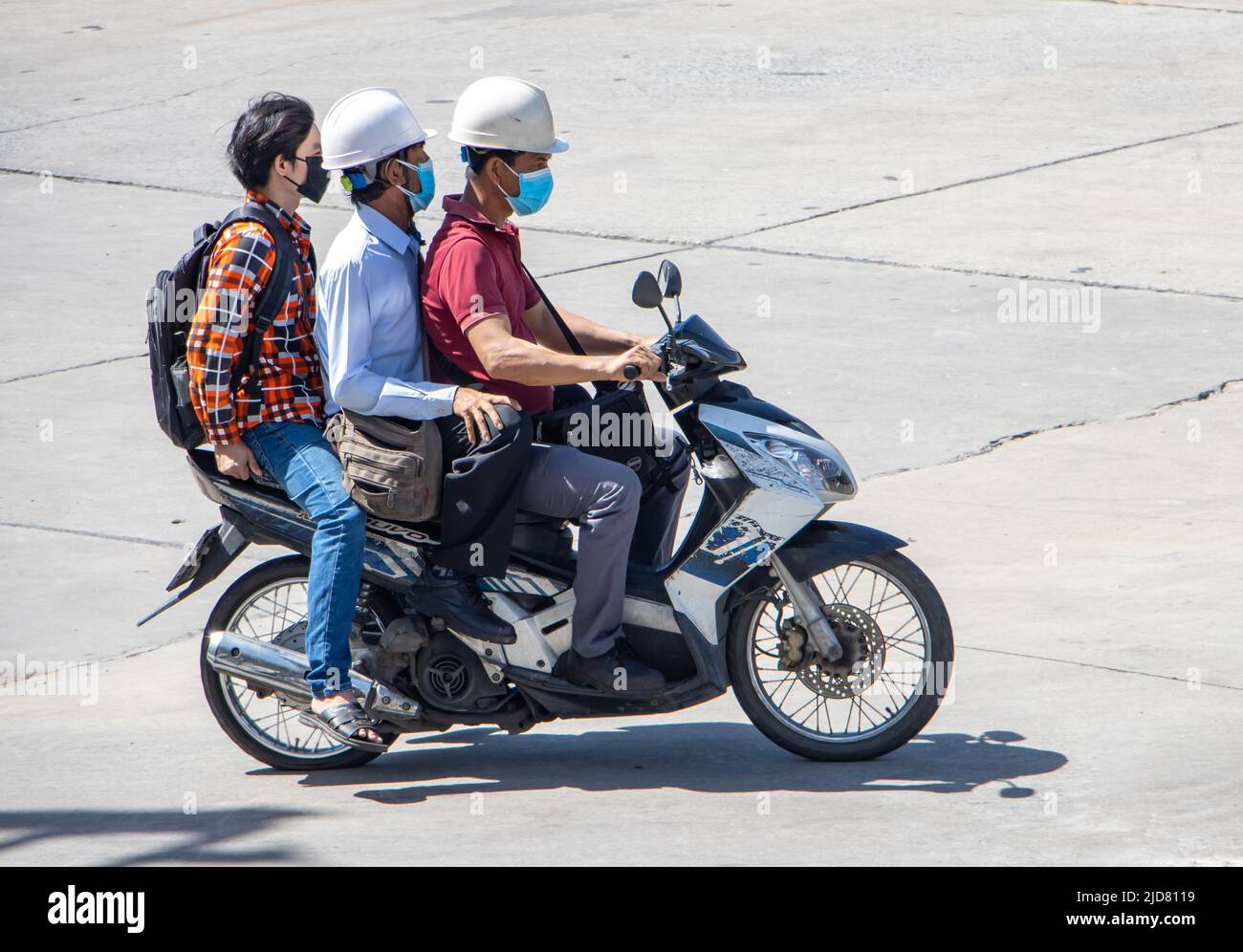 Three people riding a motorcycle hi-res stock photography and images ...