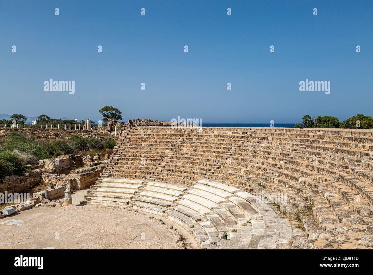 The ancient amphitheatre at Salamis in Northern Cyprus, with a blue sky ...