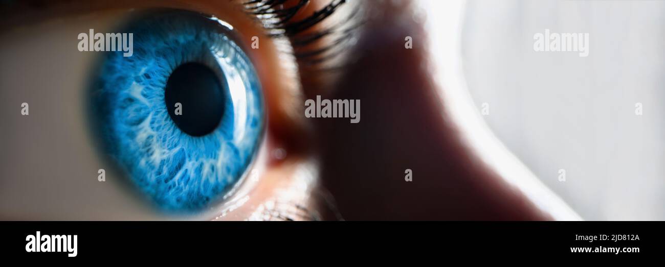 Beautiful open female eye, bright blue lenses, close-up Stock Photo - Alamy