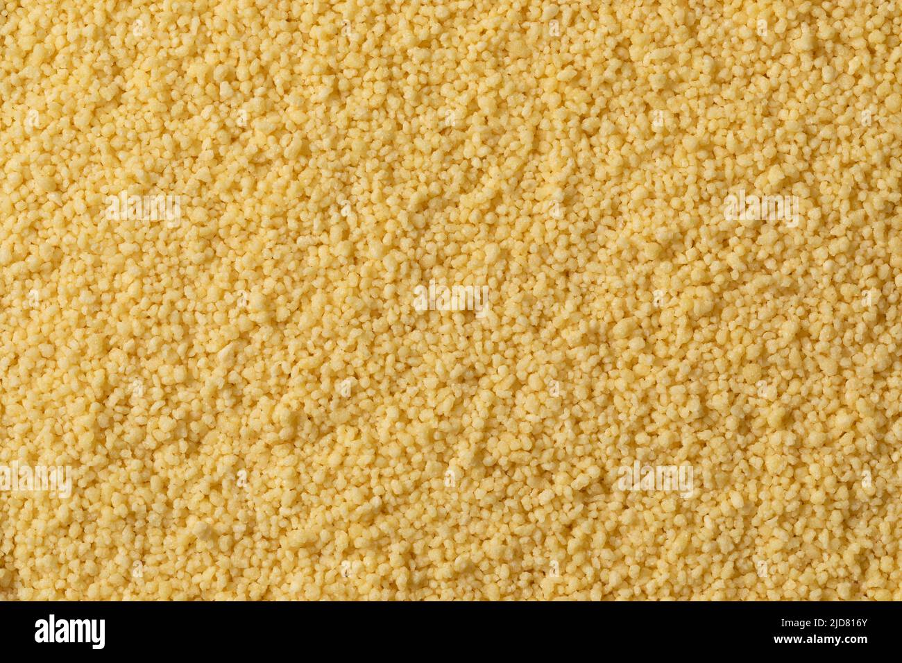 Dried uncooked couscous close up full frame as background Stock Photo ...