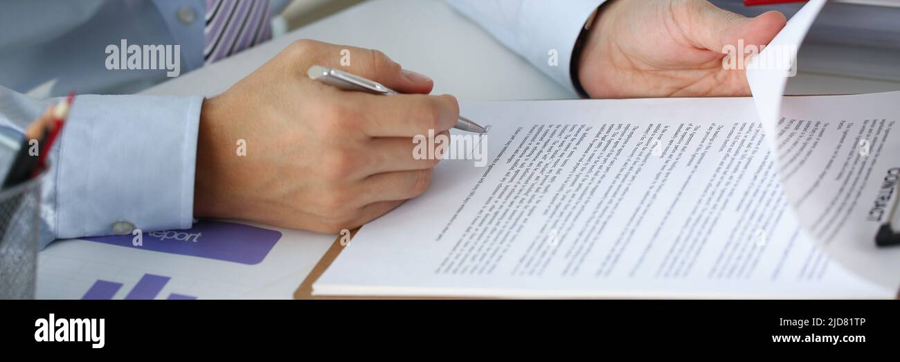 Manager signs document in office hi-res stock photography and images ...