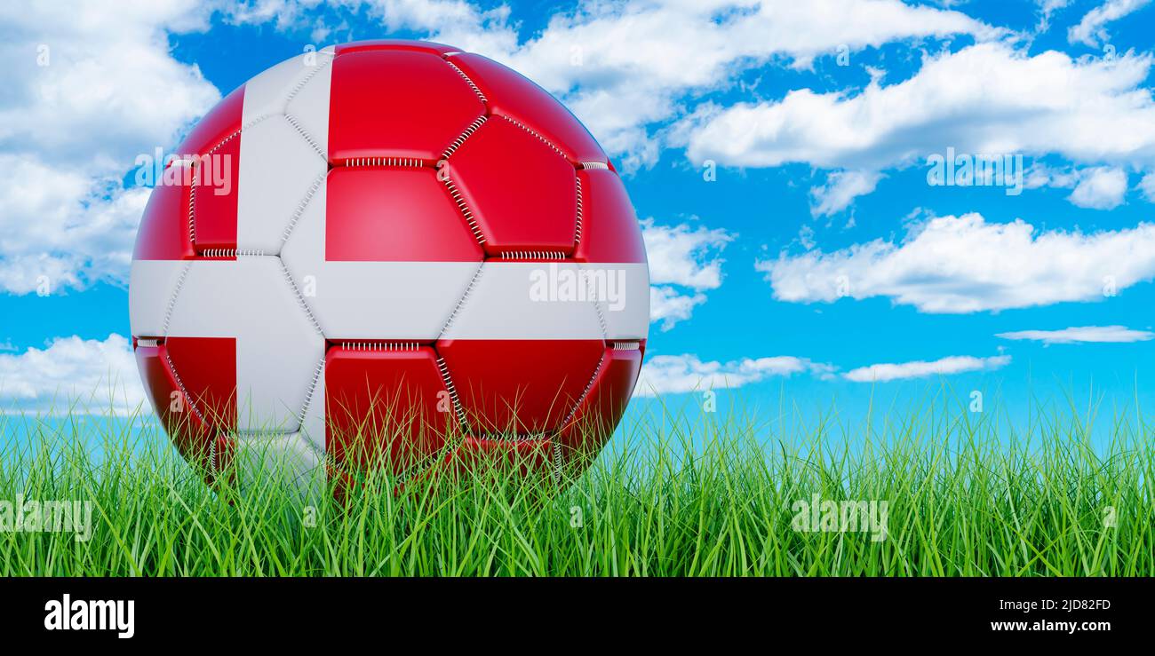 Soccer ball with Danish flag on the green grass against blue sky, 3D ...