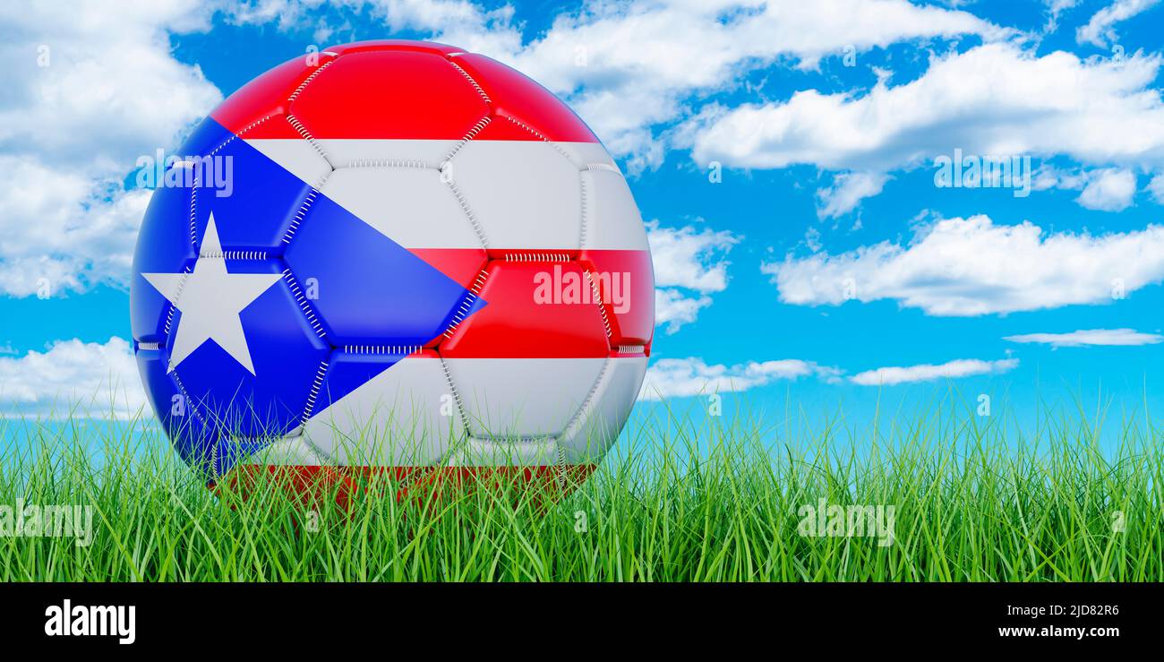 Soccer ball with Puerto Rican flag on the green grass against blue sky ...
