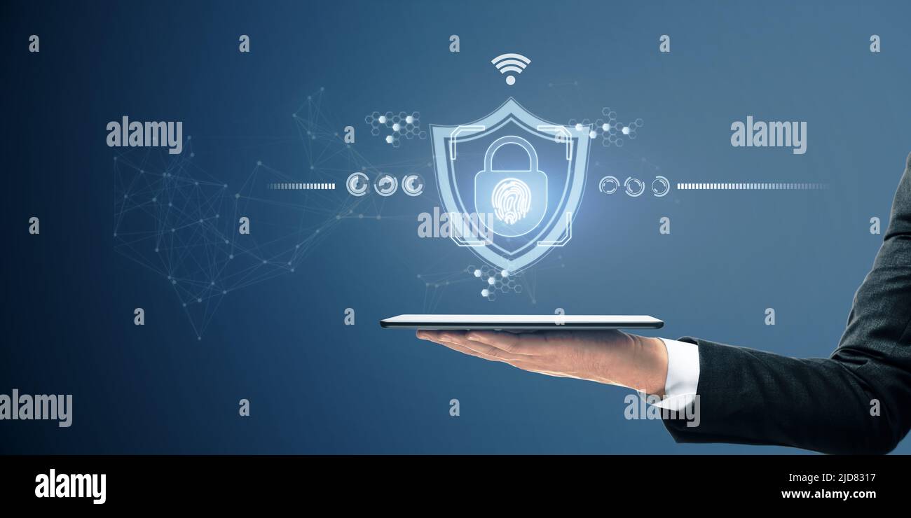 Security and internet safety concept with digital tablet on man hand and glowing digital lock ...