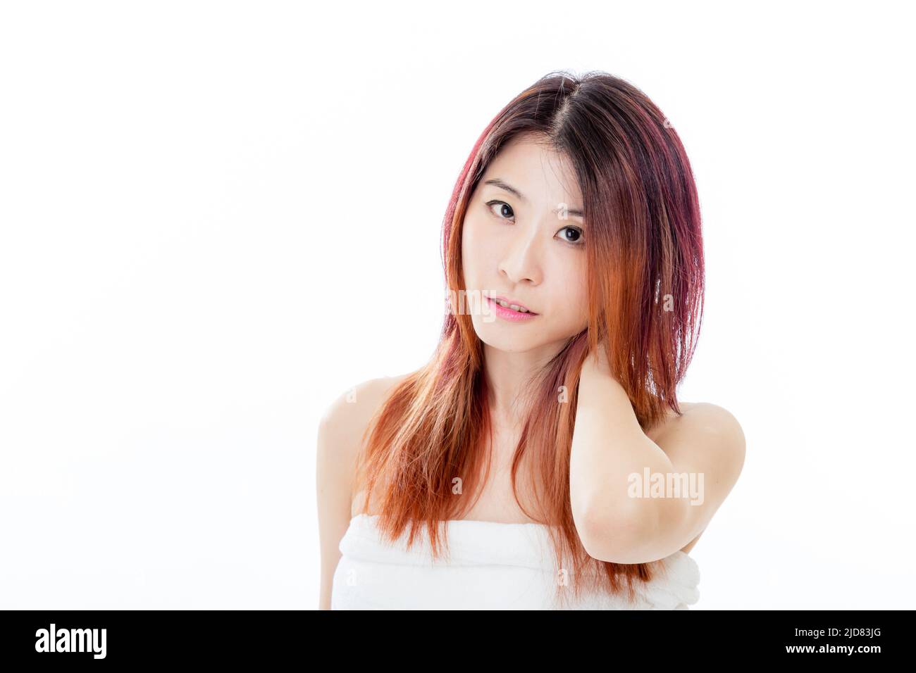 Chinese-American woman wearing a white towel on body, isolated, beauty ...