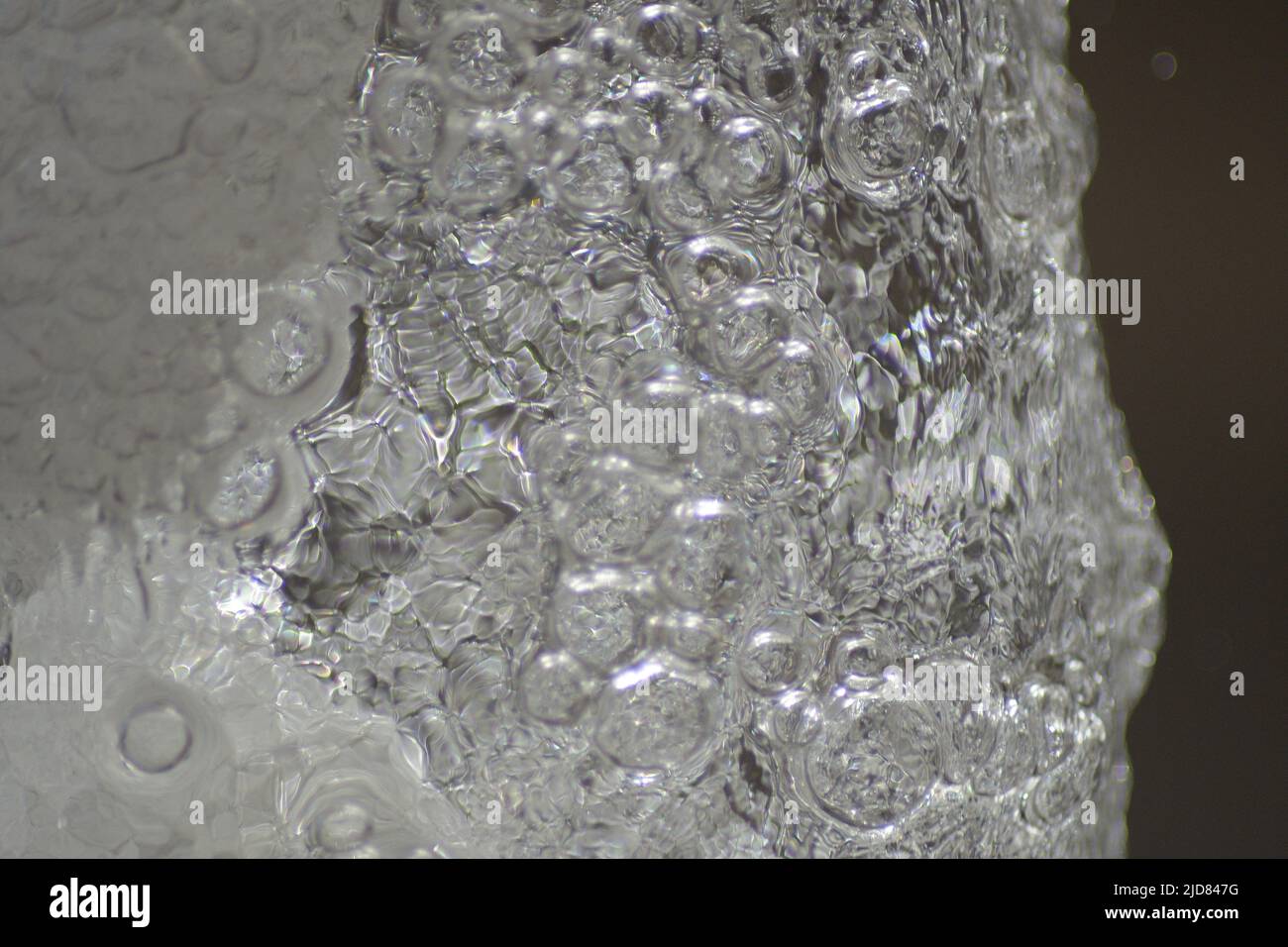 Bubbles in a water stream Stock Photo - Alamy