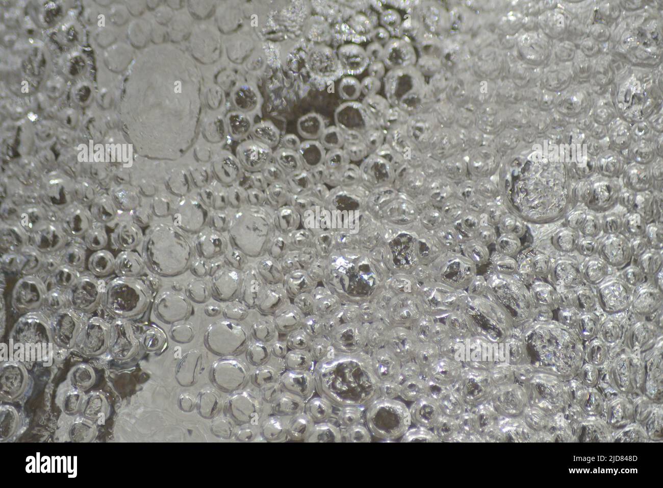 Bubbles water in a water stream Stock Photo - Alamy