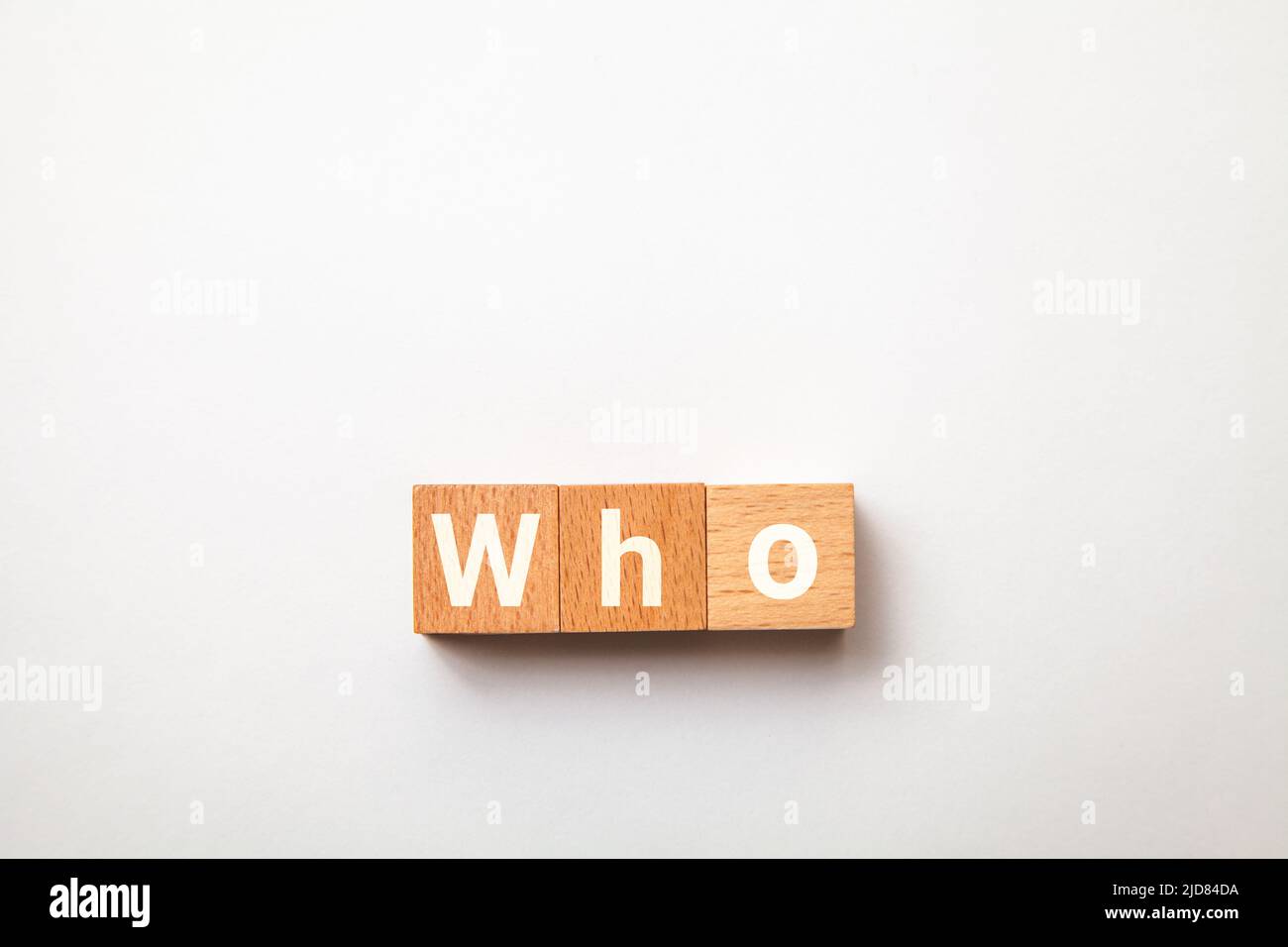 Who character. Who. Interrogative pronoun. Written on three wooden ...