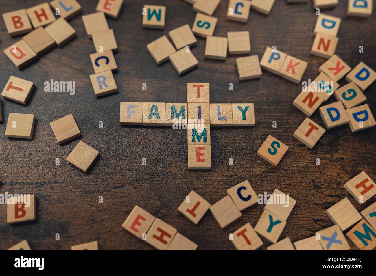 Family time. Word letter wooden puzzles as a great way of spending free ...