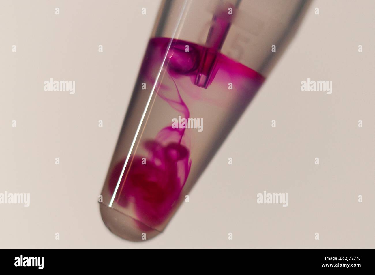 injecting coloured liquid into tube Stock Photo - Alamy
