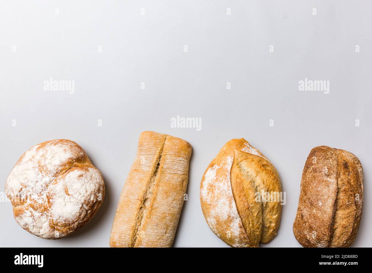 Homemade natural breads. Different kinds of fresh bread as background ...