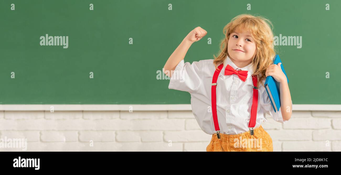 School pupil boy on blackboard, banner copy space. knowledge day ...