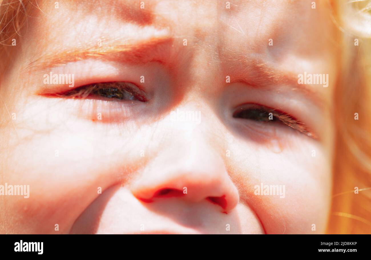 Small cute girl is crying. Sad child Stock Photo - Alamy