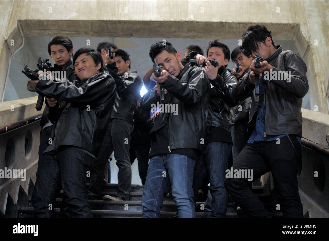 SCENE WITH GANG WITH GUNS, THE RAID 2, 2014 Stock Photo - Alamy