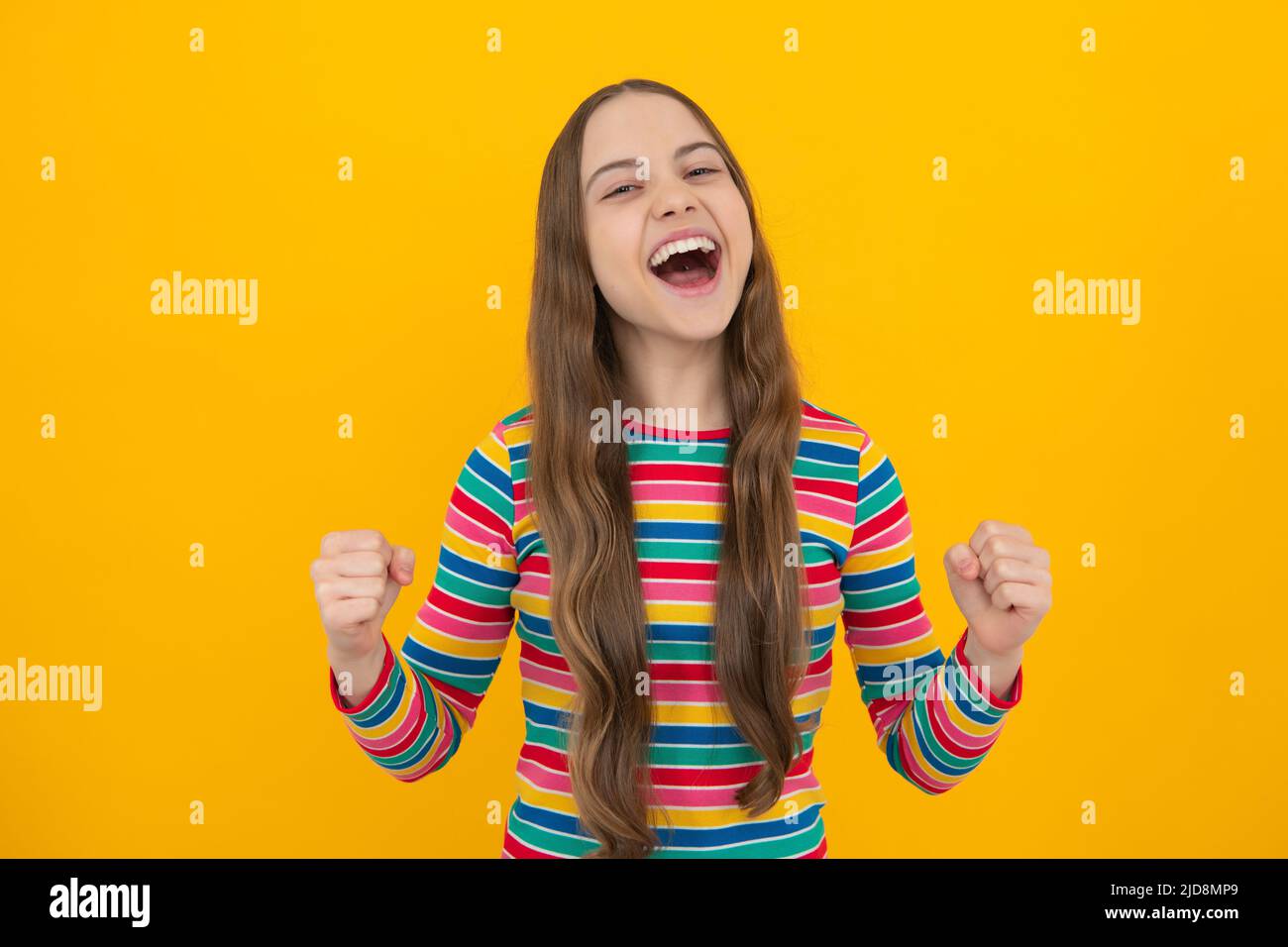 Teenager child girl rejoicing, say yes, looking happy and celebrating ...