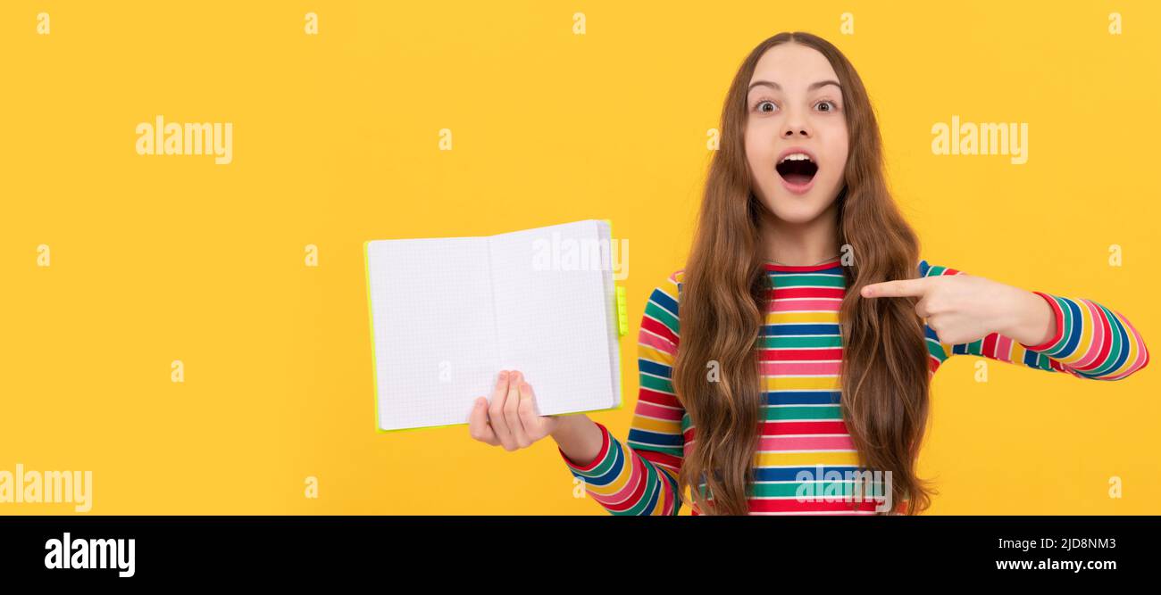 Take a look read a book. Surprised girl point finger at open book. Read ...