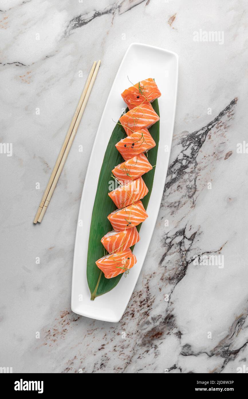 set of rolls philadelphia kappa with microgreens and green bamboo leaf ...