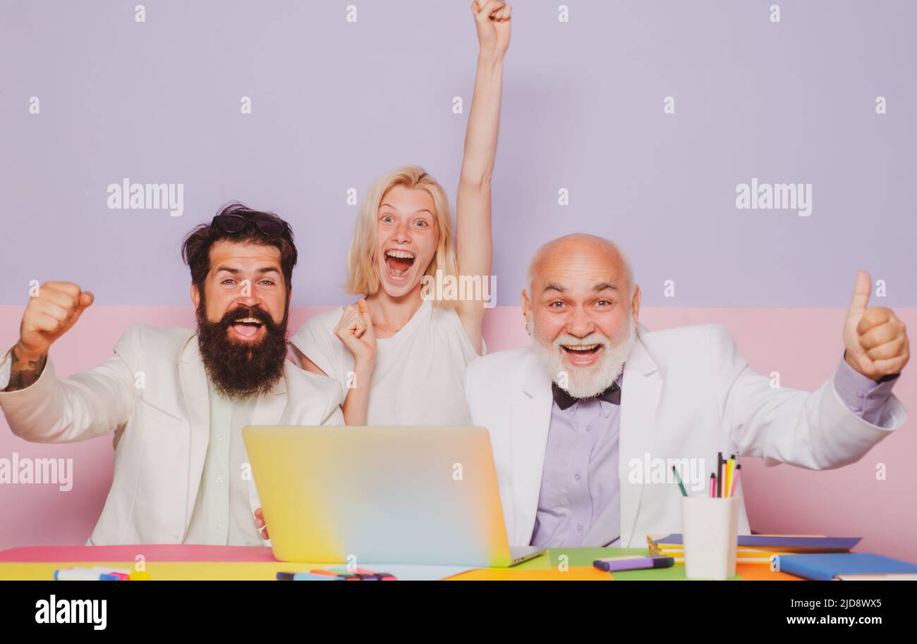 Business team celebrating a triumph with arms up. Excited group of ...