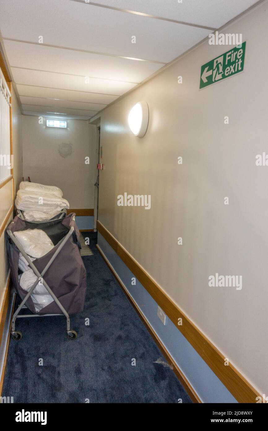 Blocked corridor leading to a fire escape door in a hotel in Bradford ...