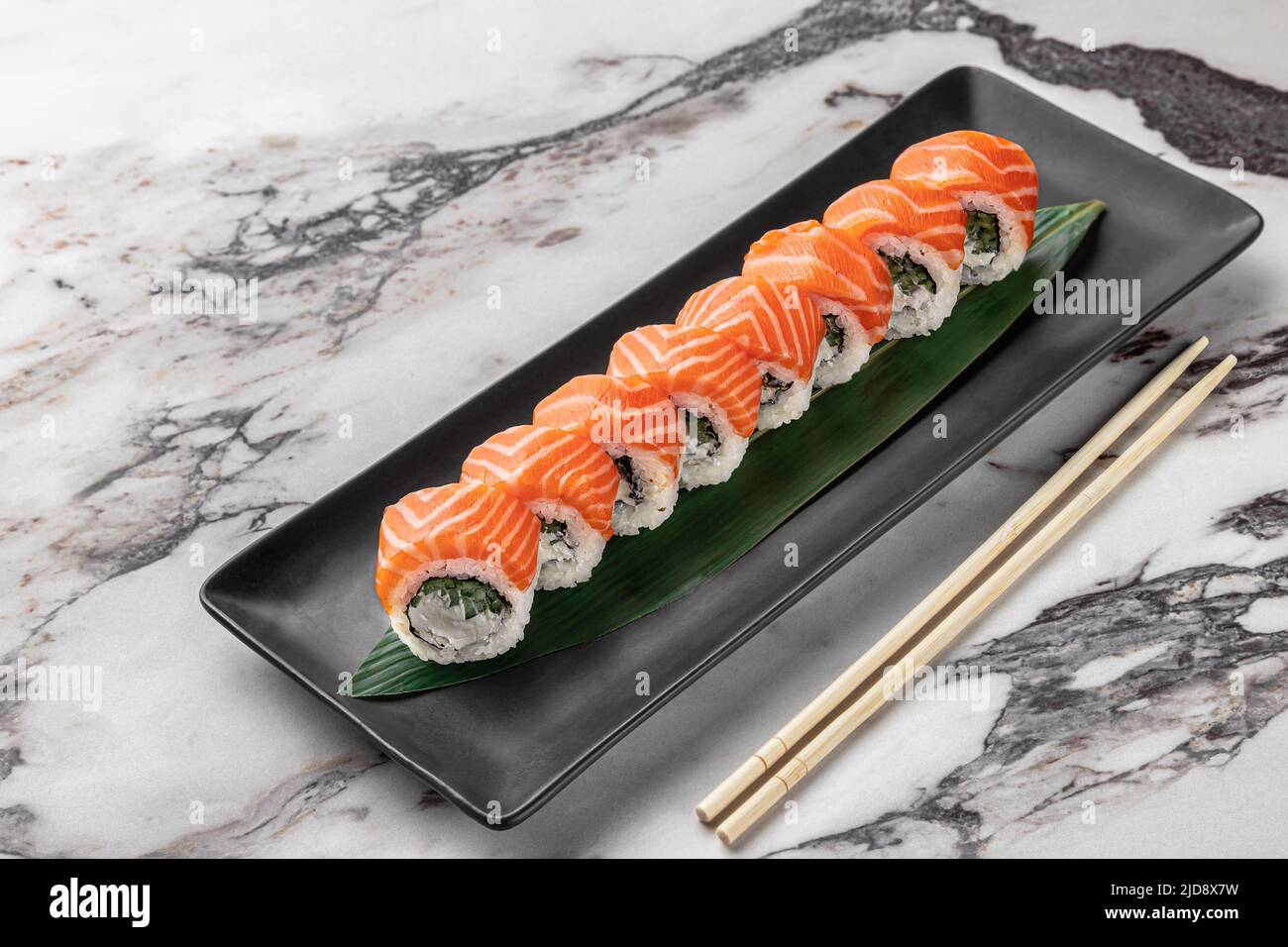 set of rolls philadelphia kappa and green bamboo leaf in a black ...