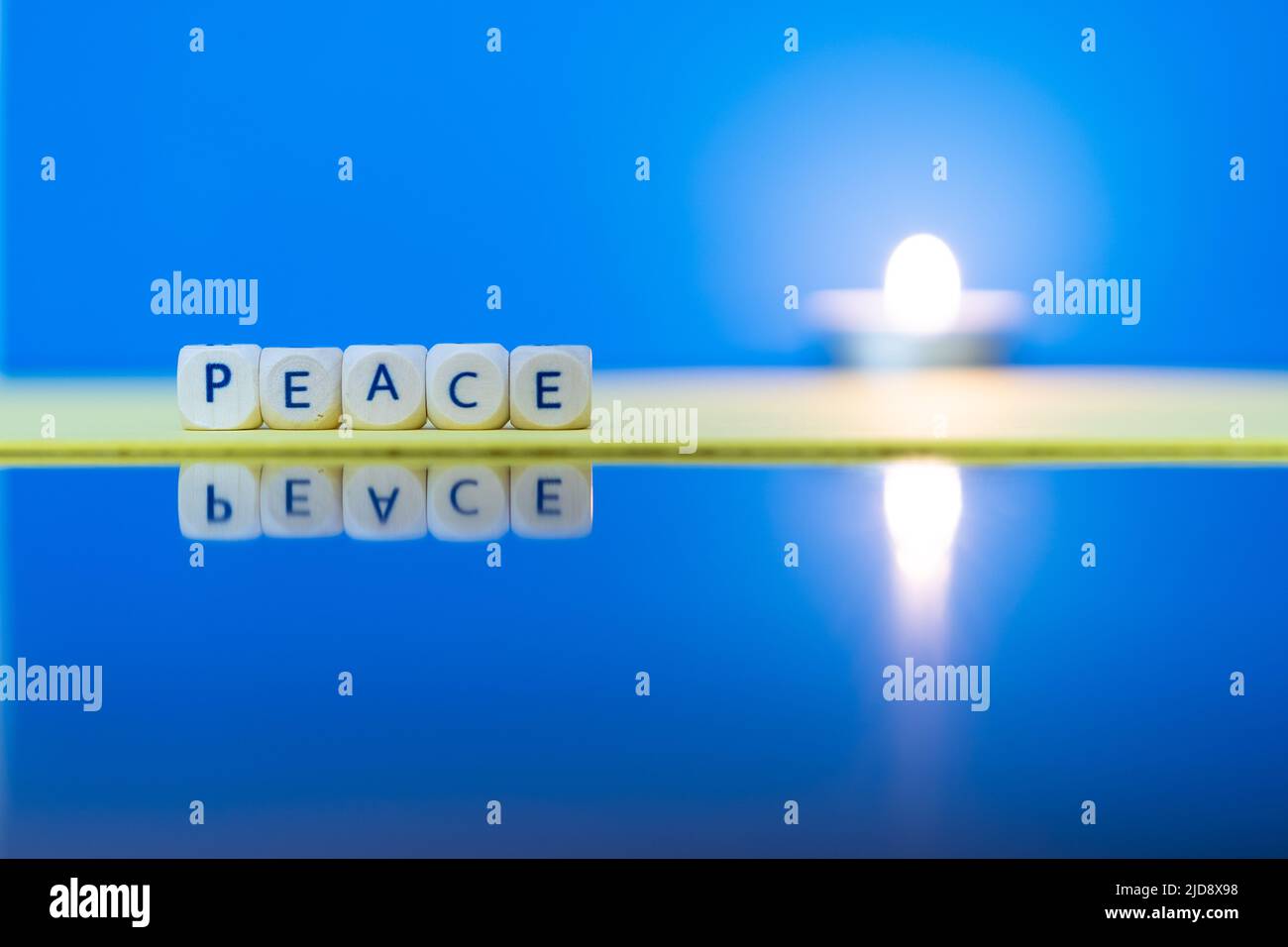 Peace letters made with wooden cubes Stock Photo - Alamy