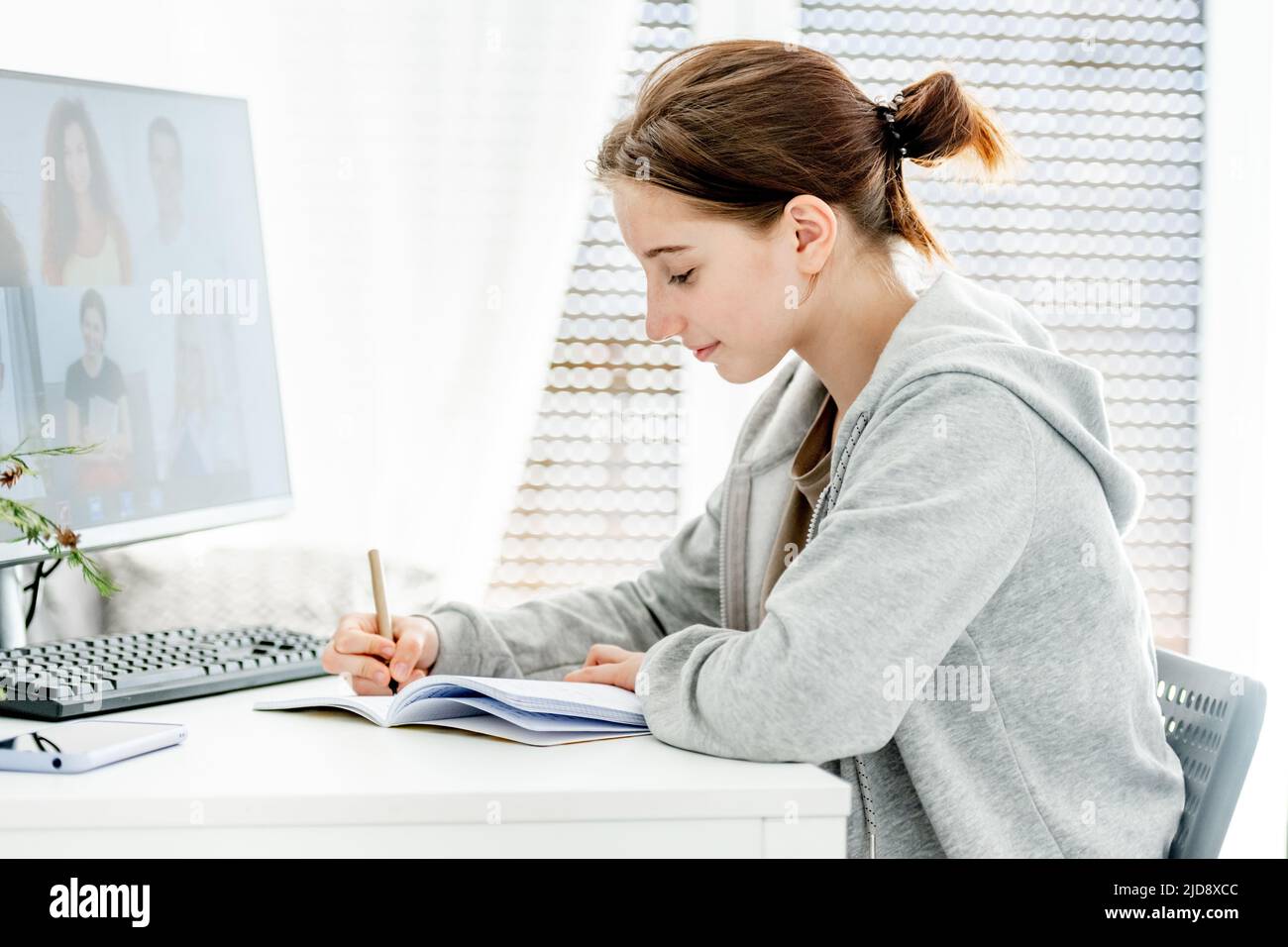 Girl studying at home Stock Photo - Alamy