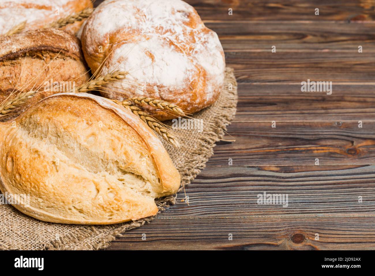 Homemade natural breads. Different kinds of fresh bread as background ...