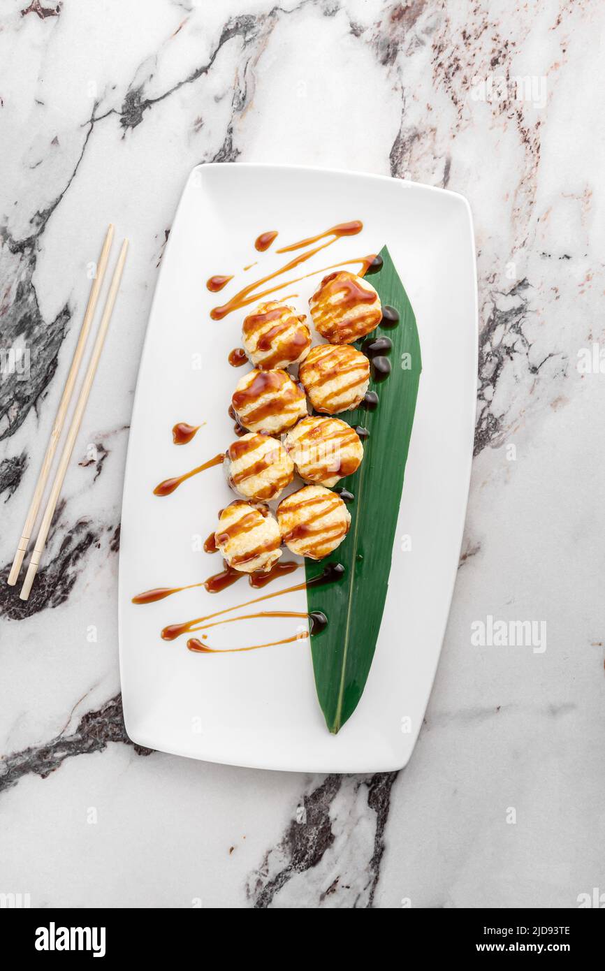 set of hot baked ricco rolls with shrimp, mozzarella, nori, rice and ...