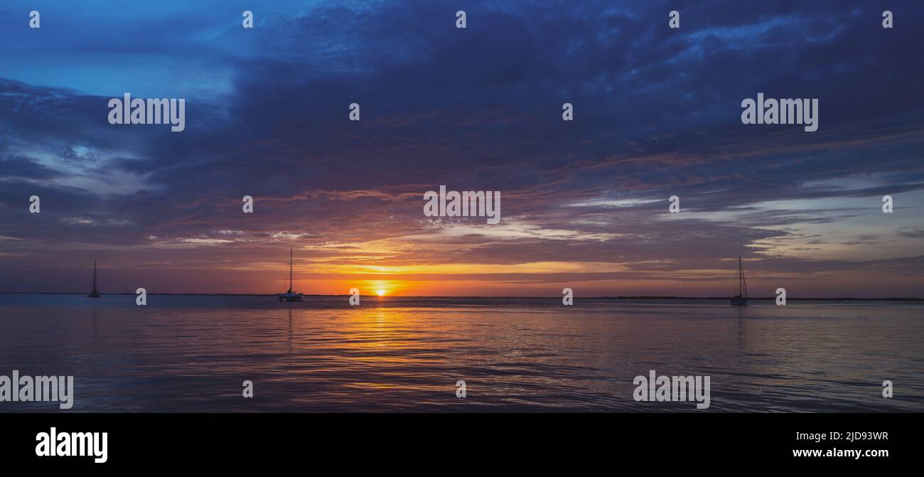 Boats on the sea at sunset. Sailboats with sails. Ocean yacht sailing ...
