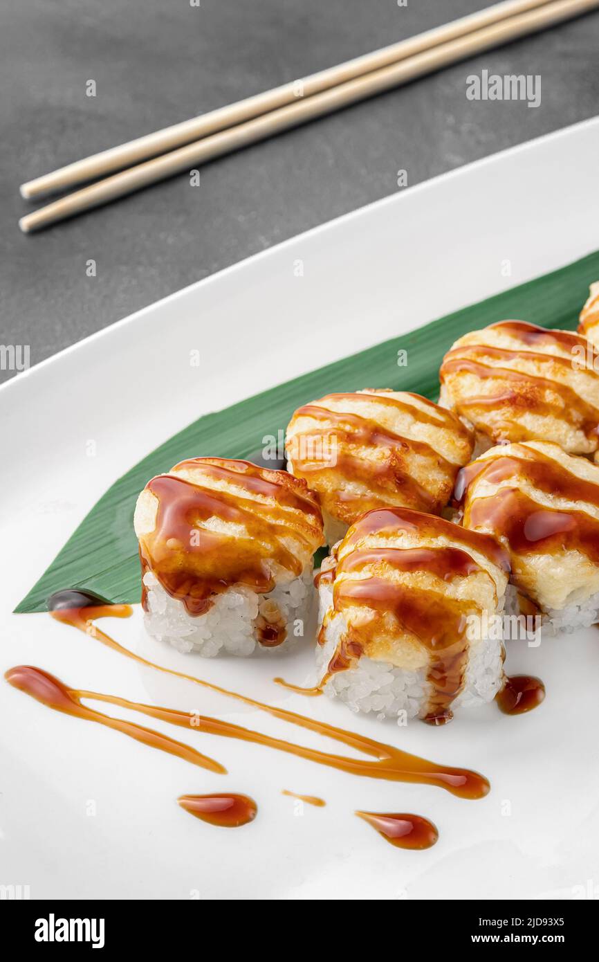 set of hot baked ricco rolls with shrimp, mozzarella, nori, rice and ...