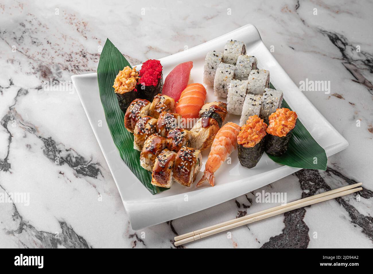 set of different colorful maki sushi rolls, nigiri and gunkan with tiger shrimp, tomago, salmon ...