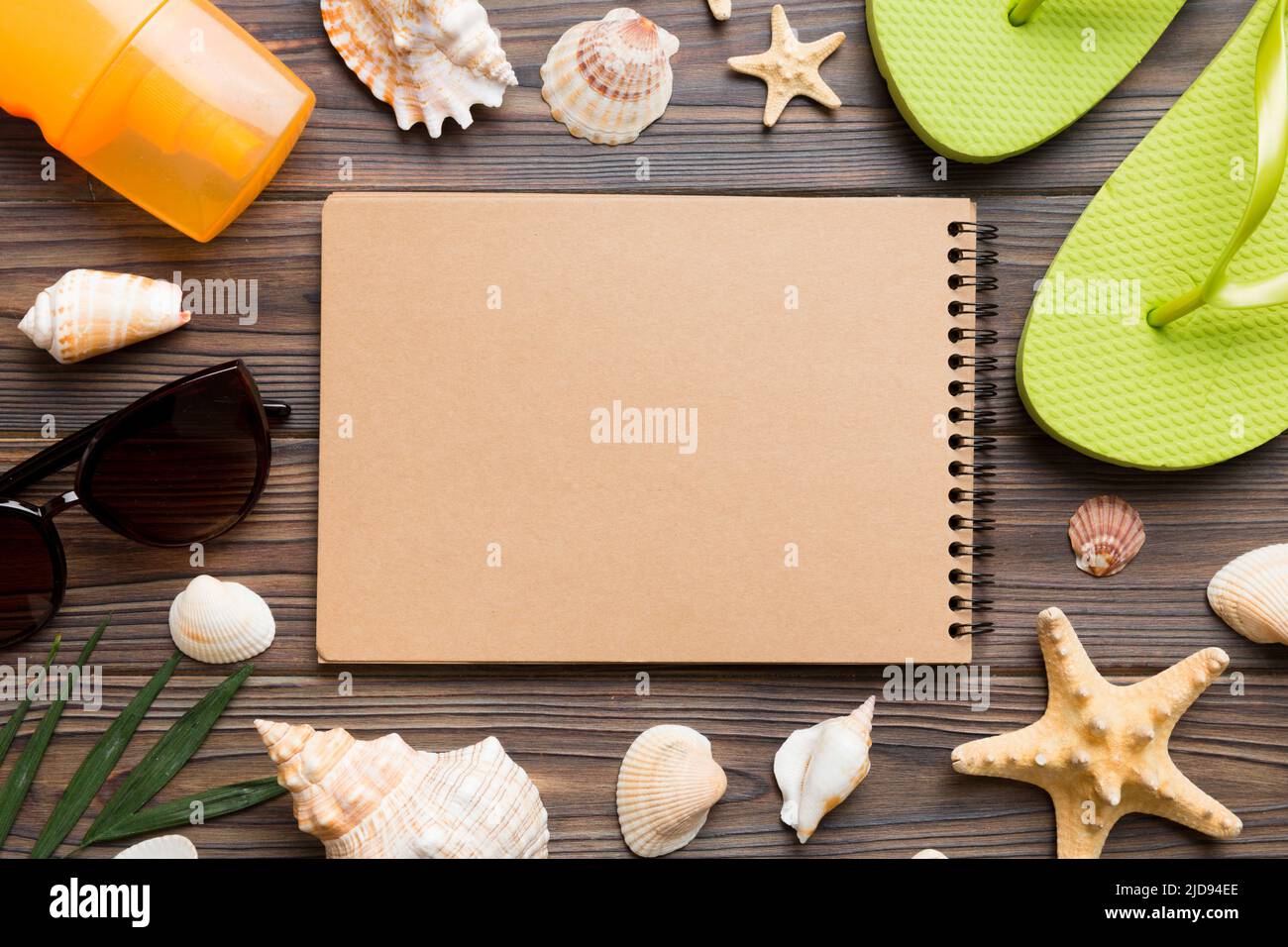 Blank writing book with summer beach accessories on background, copy ...