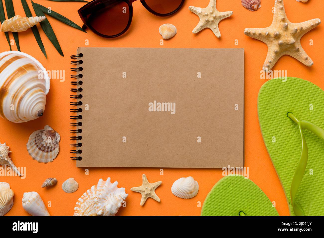 Blank writing book with summer beach accessories on background, copy ...