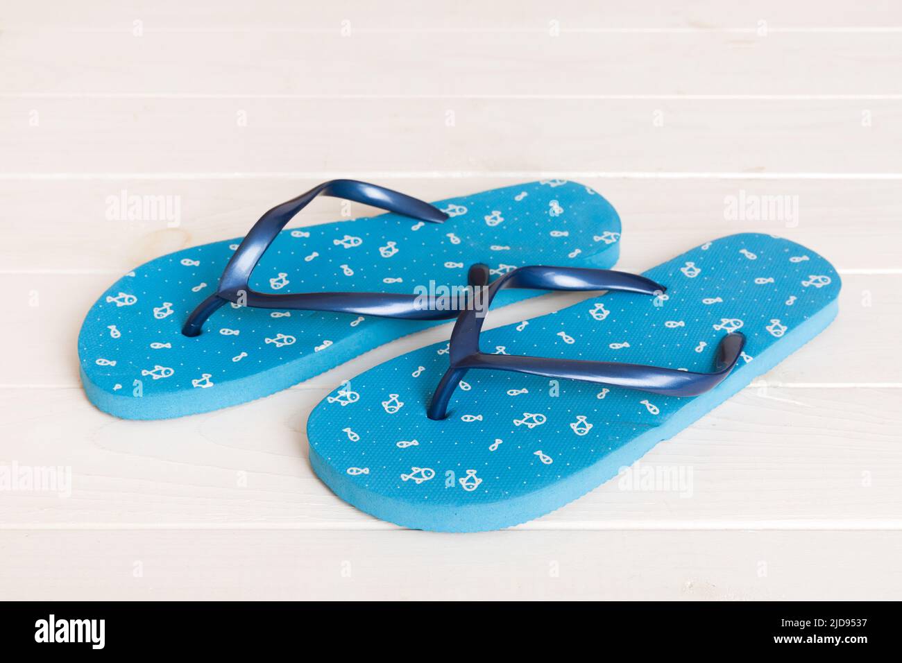 Beach accessories. Flip flops and starfish on colored background. Top ...