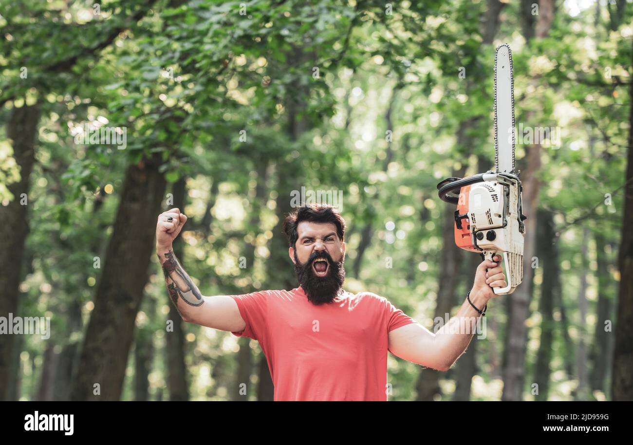 Chainsaw. Woodworkers lumberjack. Lumberjack worker with chainsaw in ...
