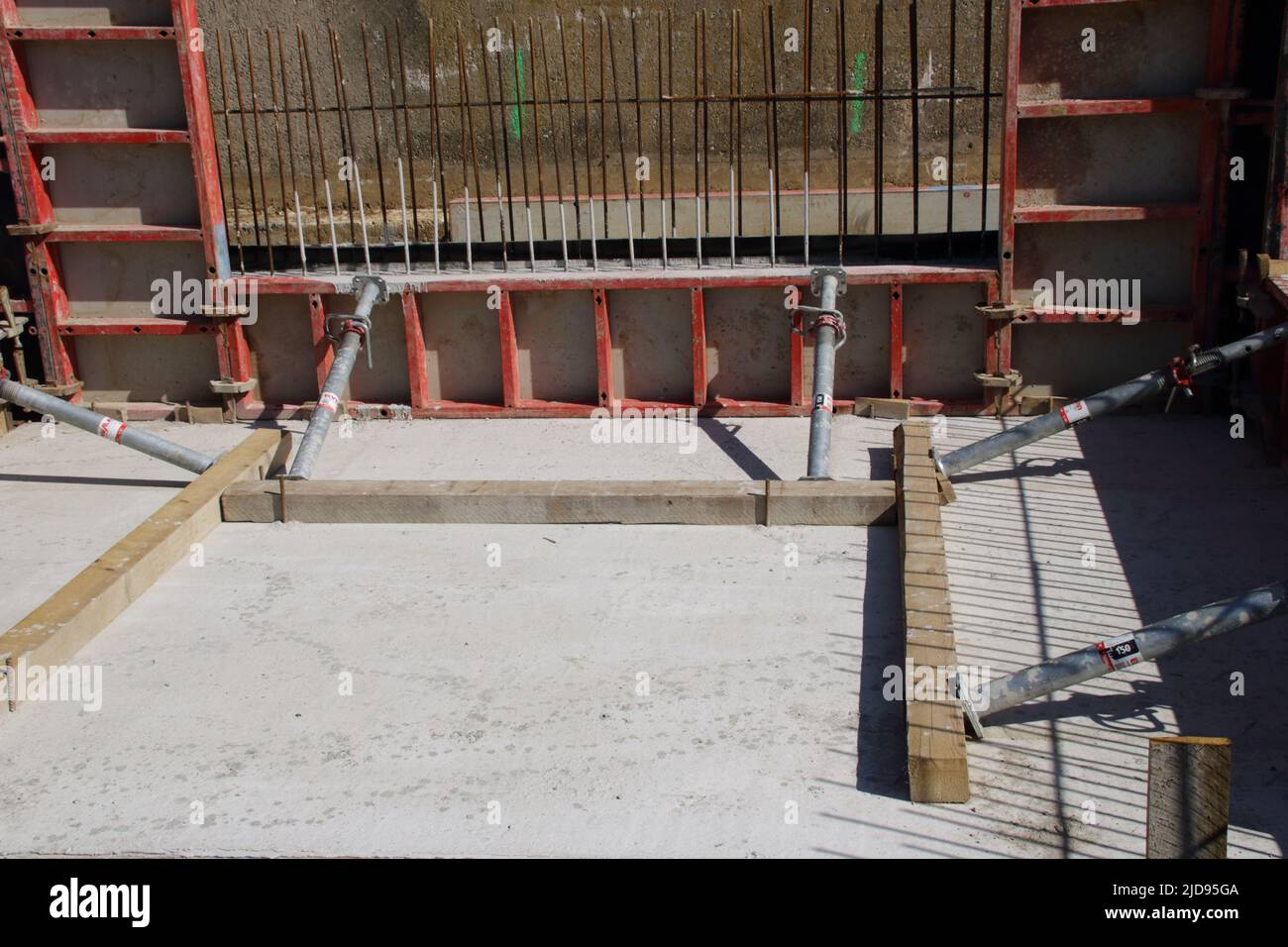 Formwork for a concrete wall was secured against slipping with struts ...