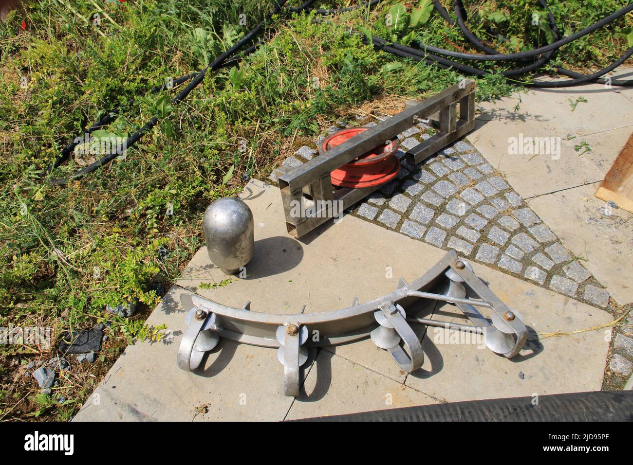 Deflection roller for guiding a hose in the duct Stock Photo - Alamy