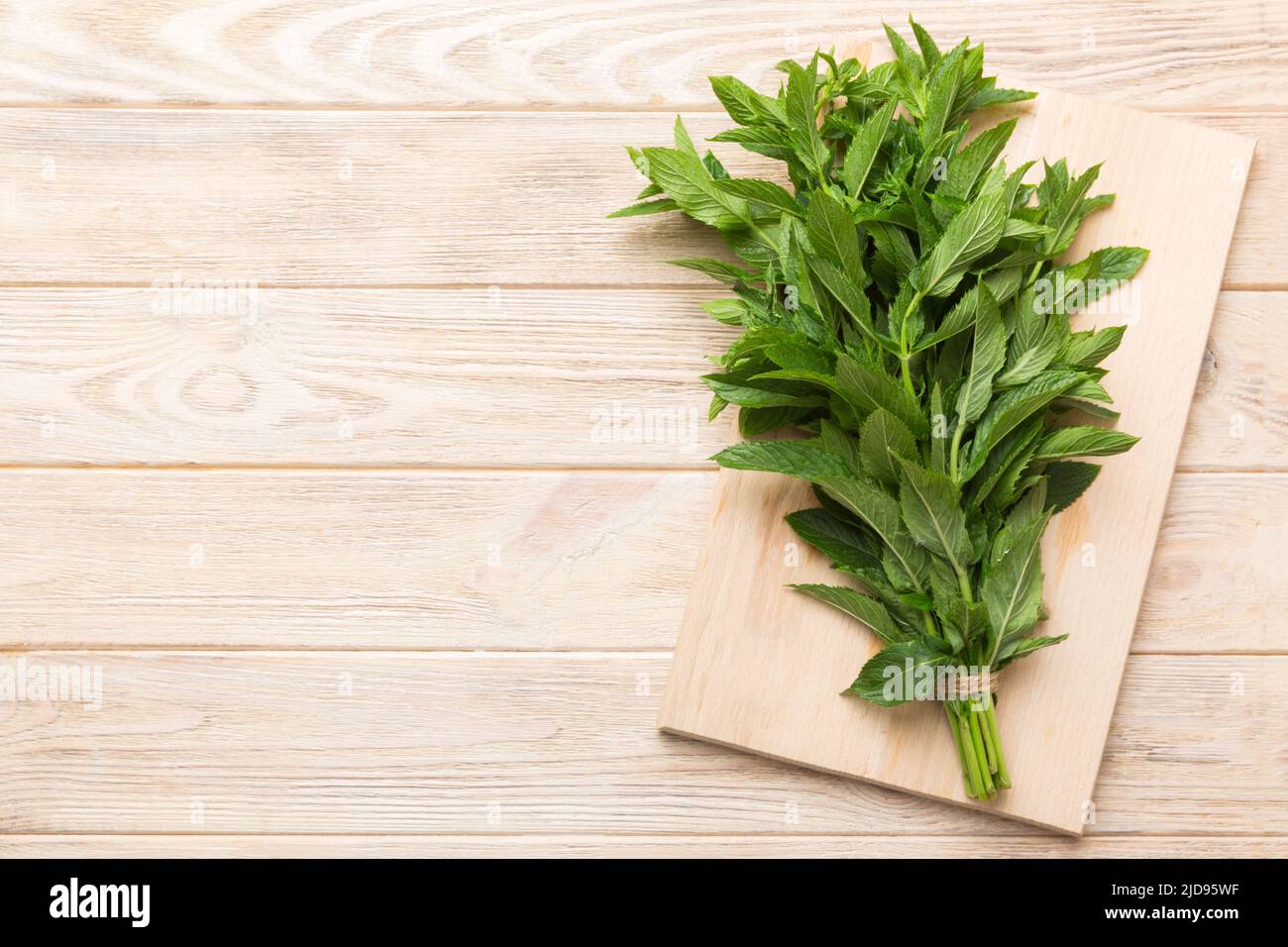 Fresh mint bunch on colored table. Top view with copy space Stock Photo ...