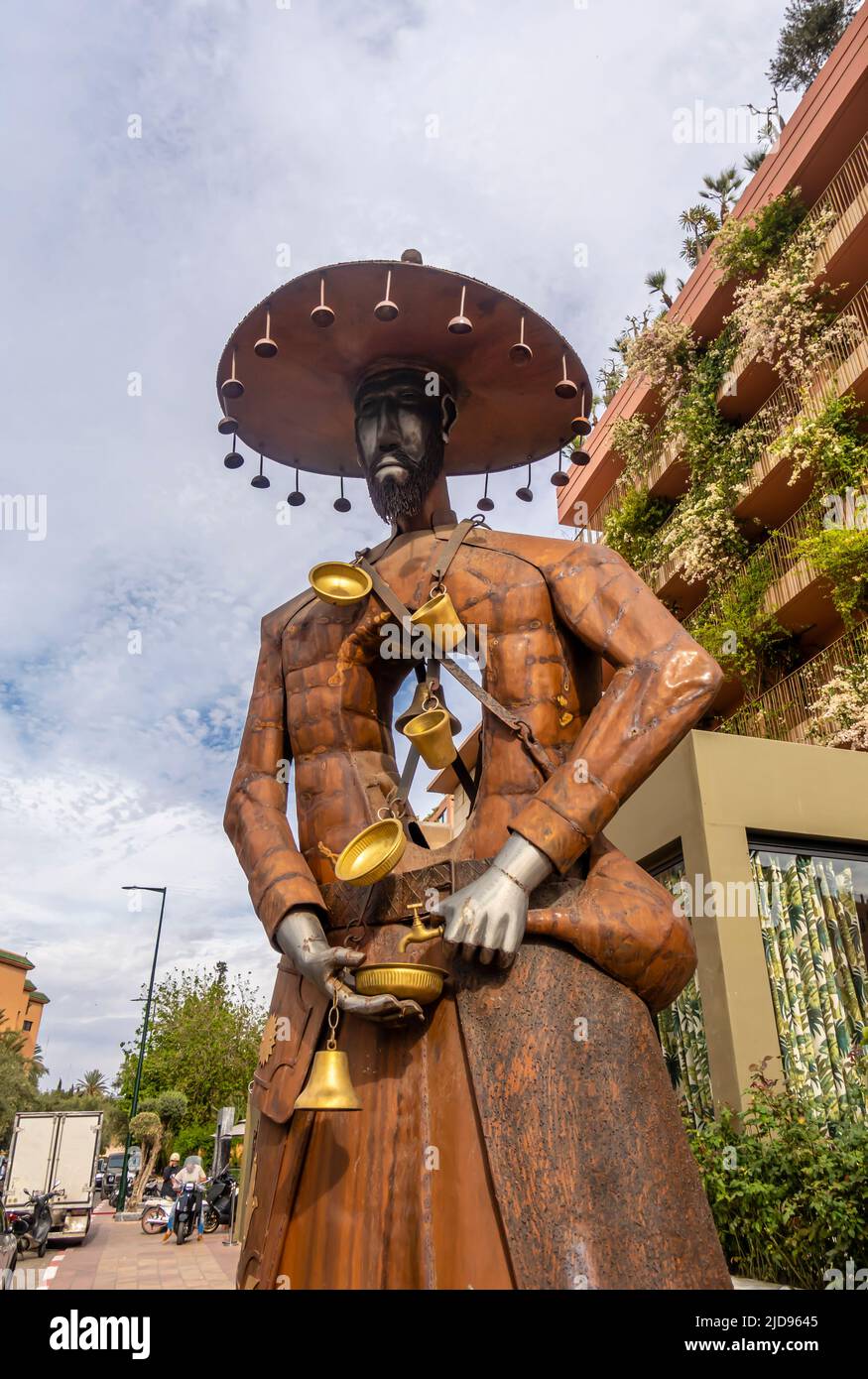Statue depicting water man in hat, Marrakech, Morocco Stock Photo - Alamy