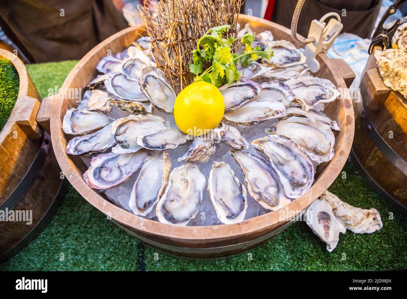 The giant oysters on ice with lemon, seafood in the market Stock Photo ...