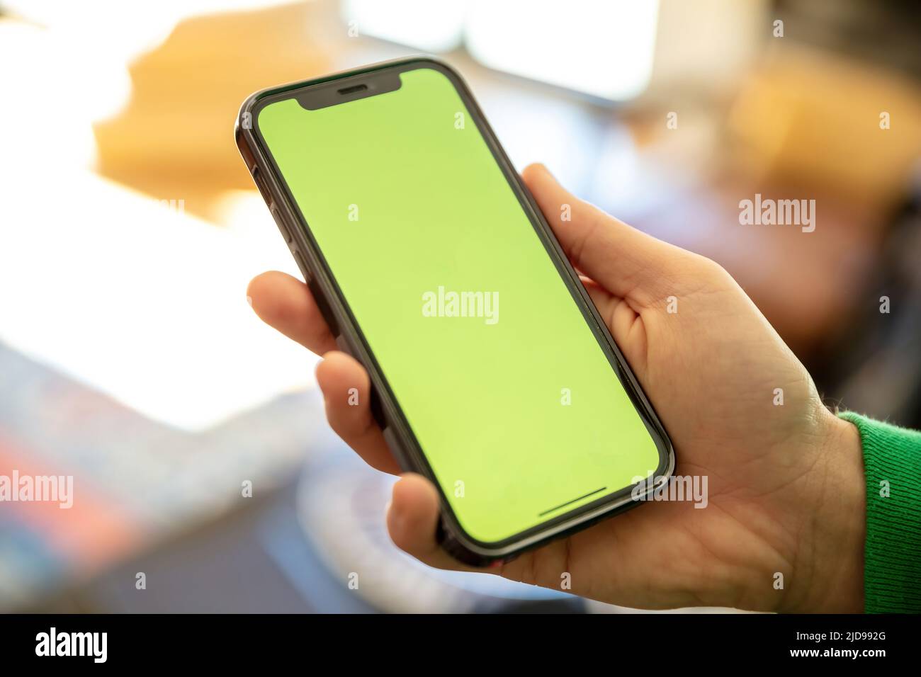 Hand hold cellphone with blank screen, closeup. Mobile phone empty ...