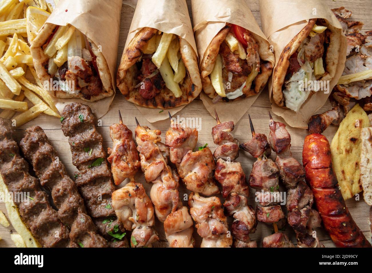 Greek street food variety, gyro sliced meat pita bread wrap, chiken and ...