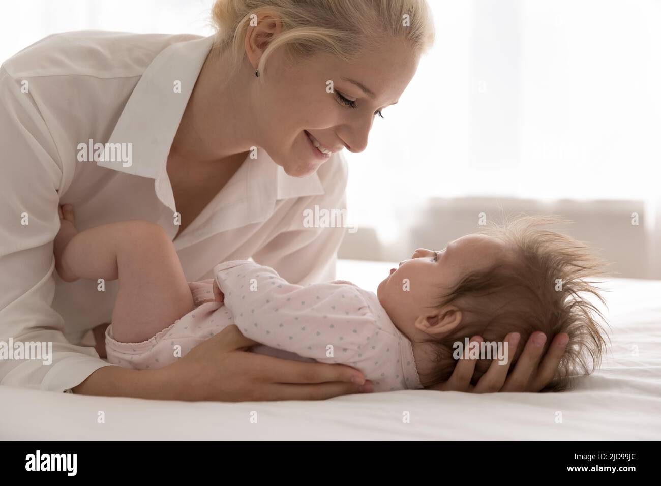 Close up shot loving mother touch her lovely newborn baby Stock Photo ...