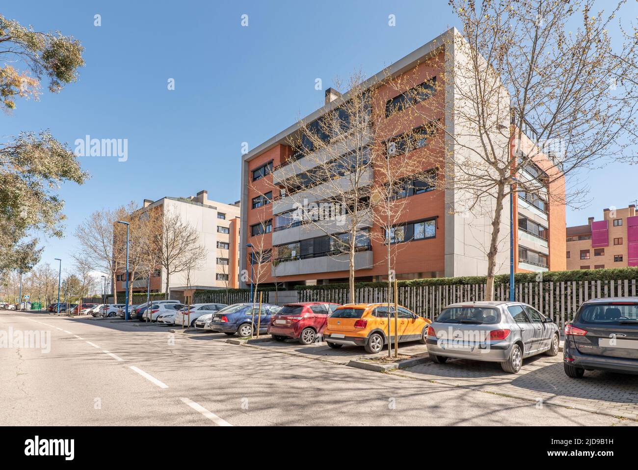 Facades of modern urban residential buildings seen from street level ...