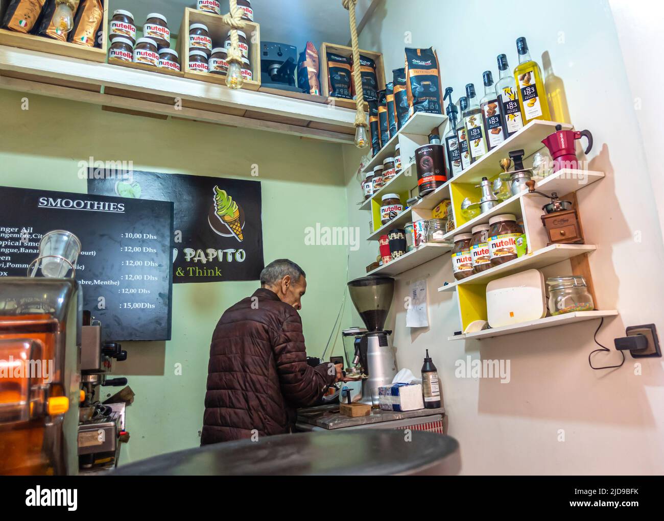 An owner of coffee shop cooking coffee in his stall in Kasbah ...