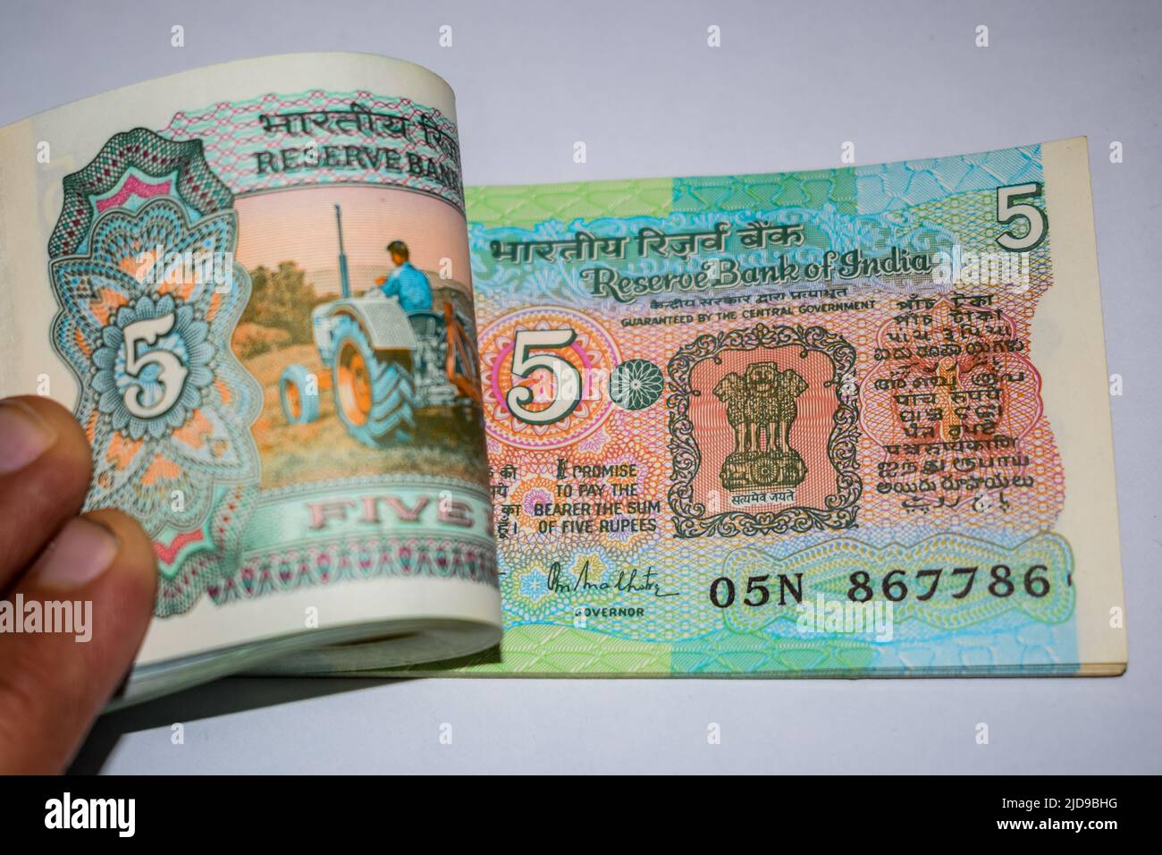 Old Five Rupee notes combined on the table, India money on the rotating ...